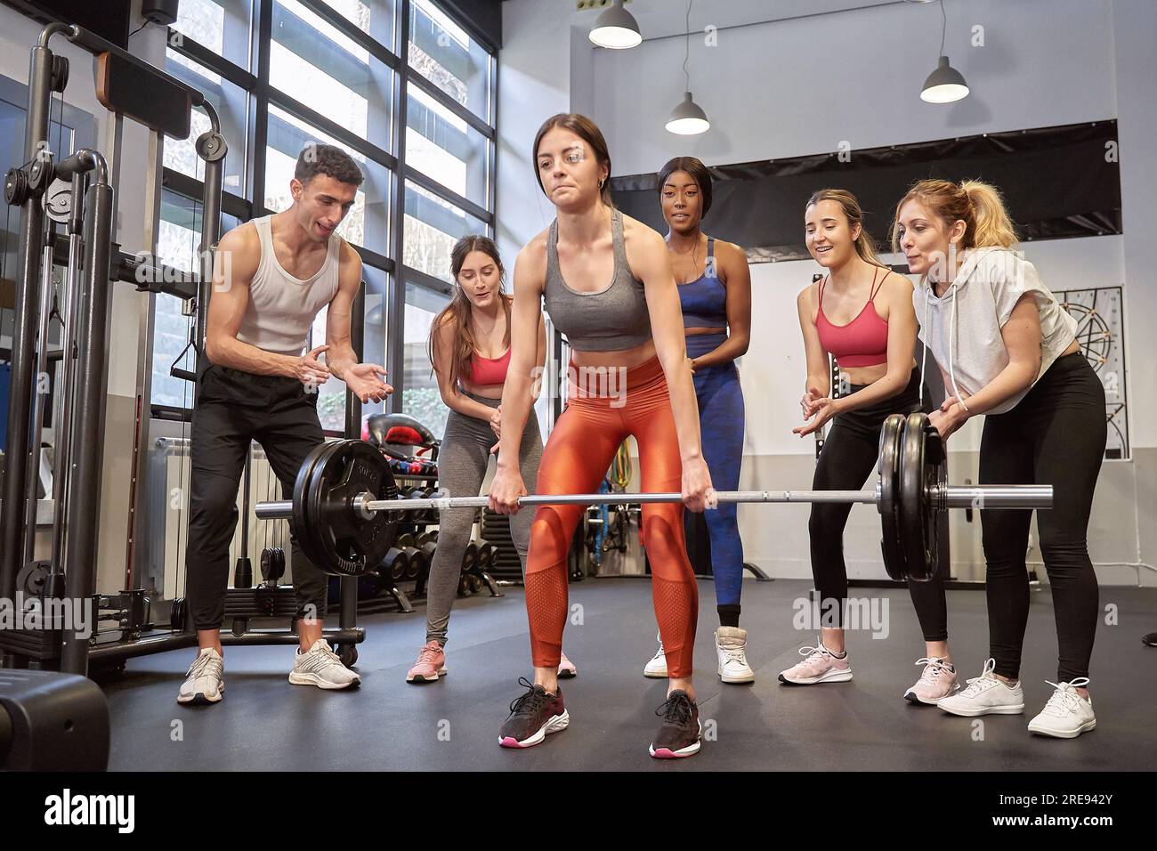 Supportive Group of Friends Encouraging and Cheering On a Woman as She ...