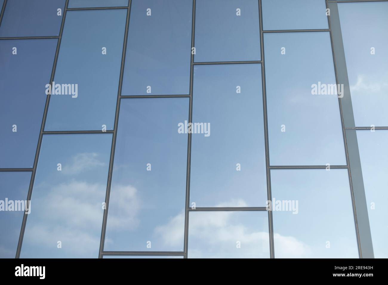 Mirror wall. Texture of building. Reflection of sky in mirrors. Details ...