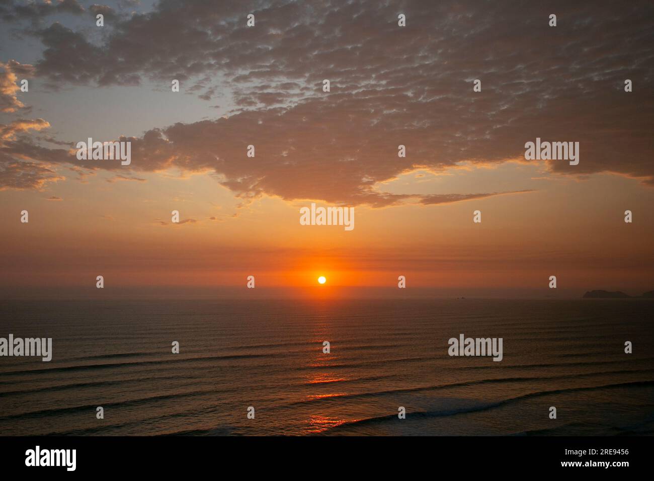 Sunset at sea seen from the Miraflores neighborhood in the city of Lima ...