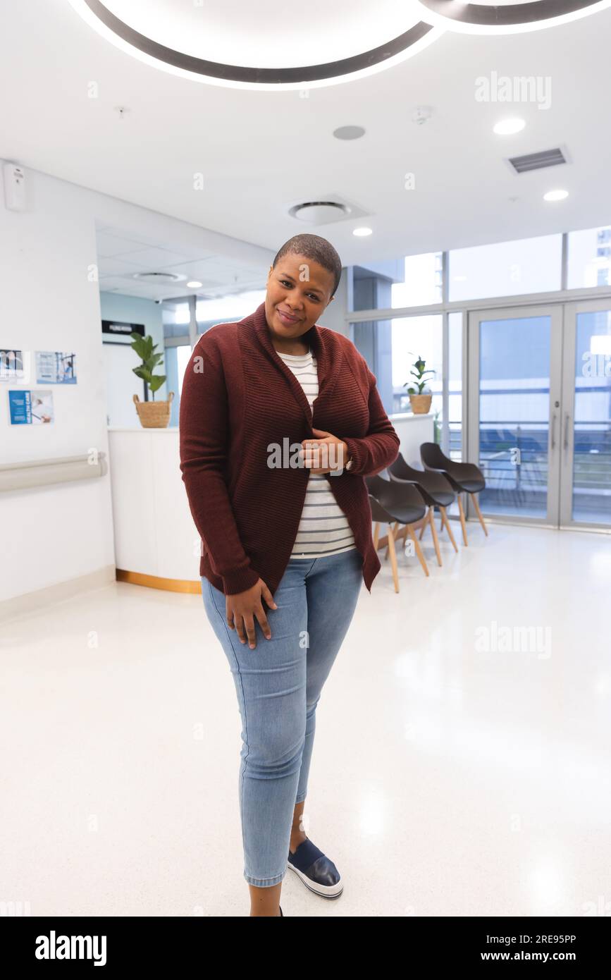 Portrait of happy african american female patient in waiting room at ...