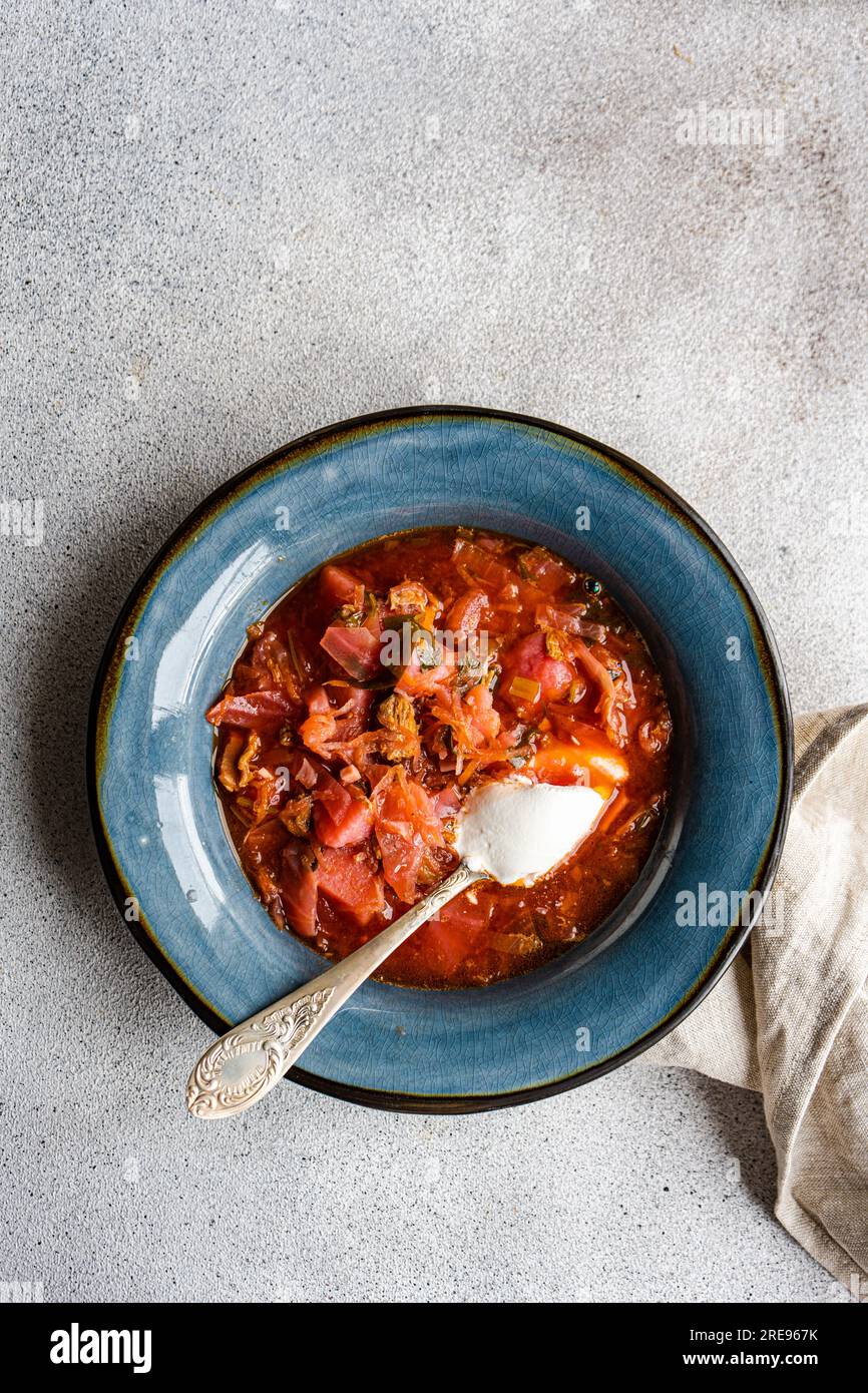 Top view of bowl with traditional Ukrainian soup borscht served in blue ...