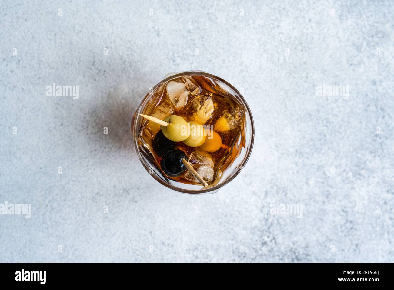 Top view of transparent glass cup with whiskey alcoholic drink and ...