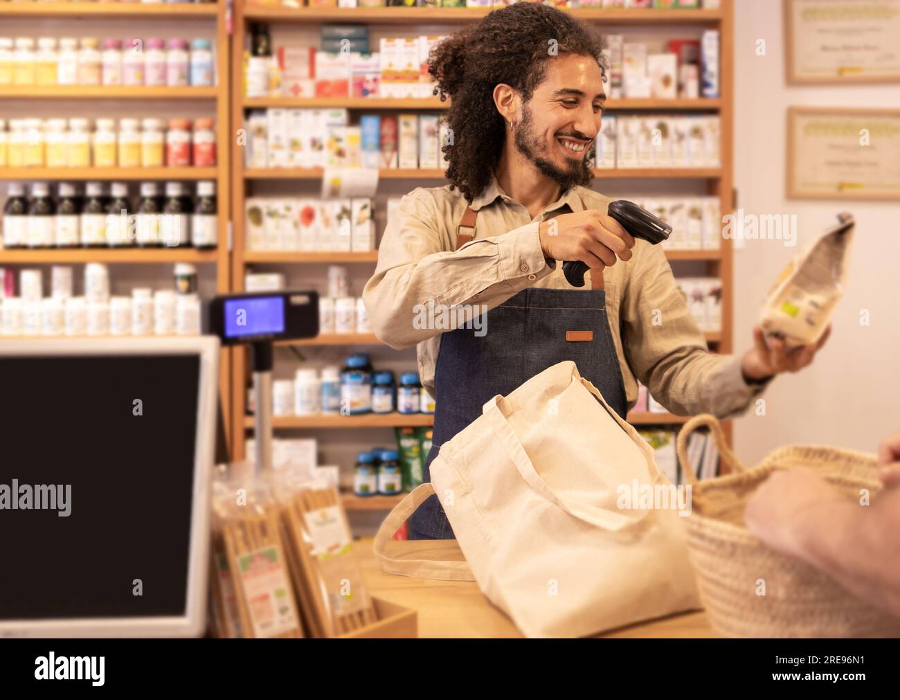 Male cashier hi-res stock photography and images - Alamy