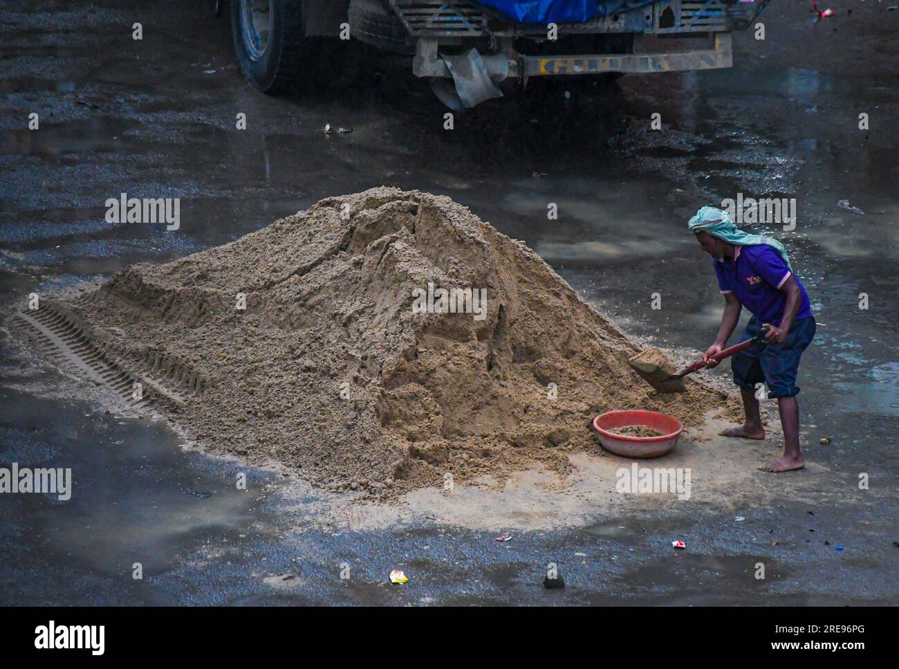 A labourer works at a residential construction site in Imphal. In India ...