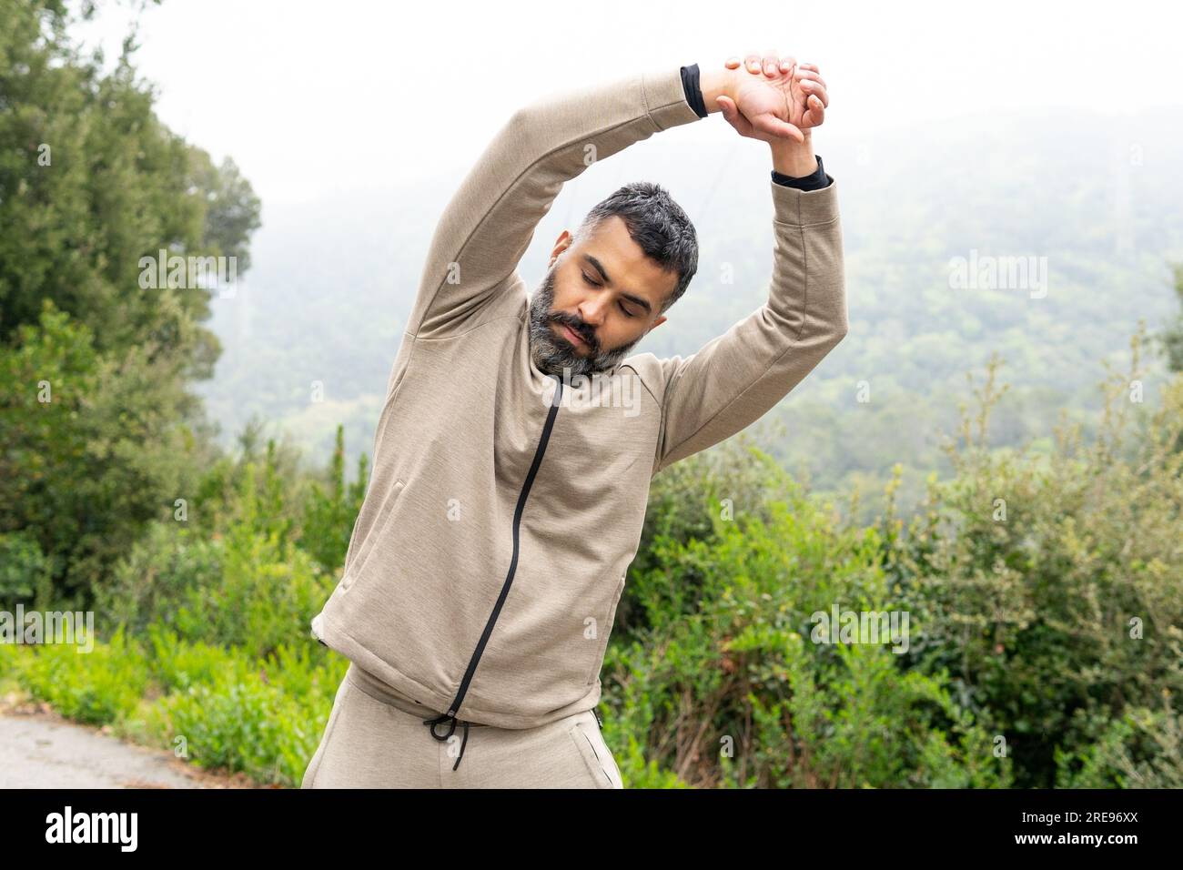Man stretching above head hi-res stock photography and images - Alamy