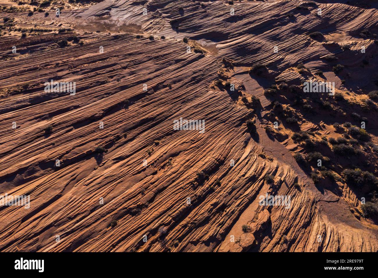 From above rough textured surface of sandstone cliff with cracks and ...