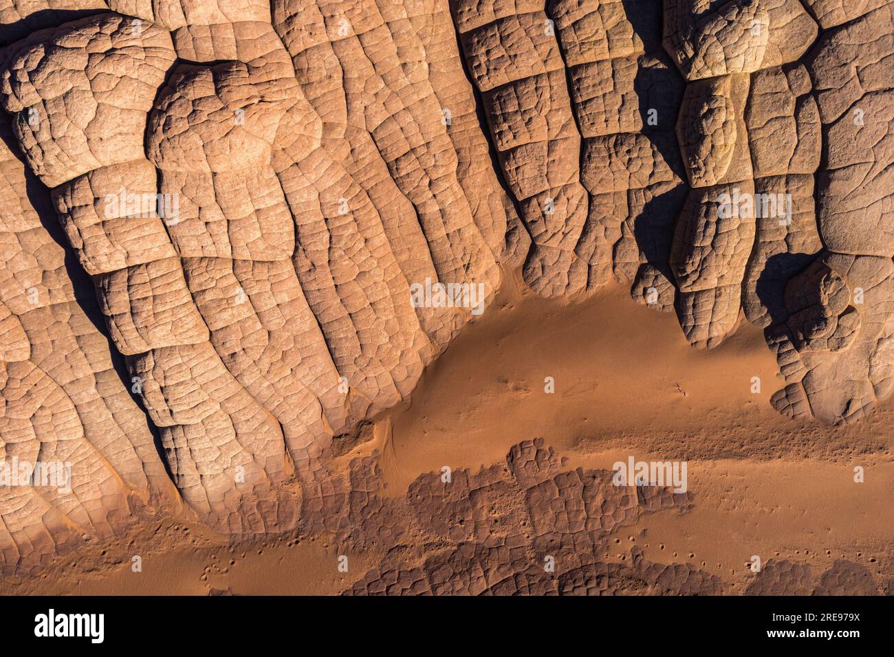 Breathtaking drone view of rough rocky formations and sandy ground on ...