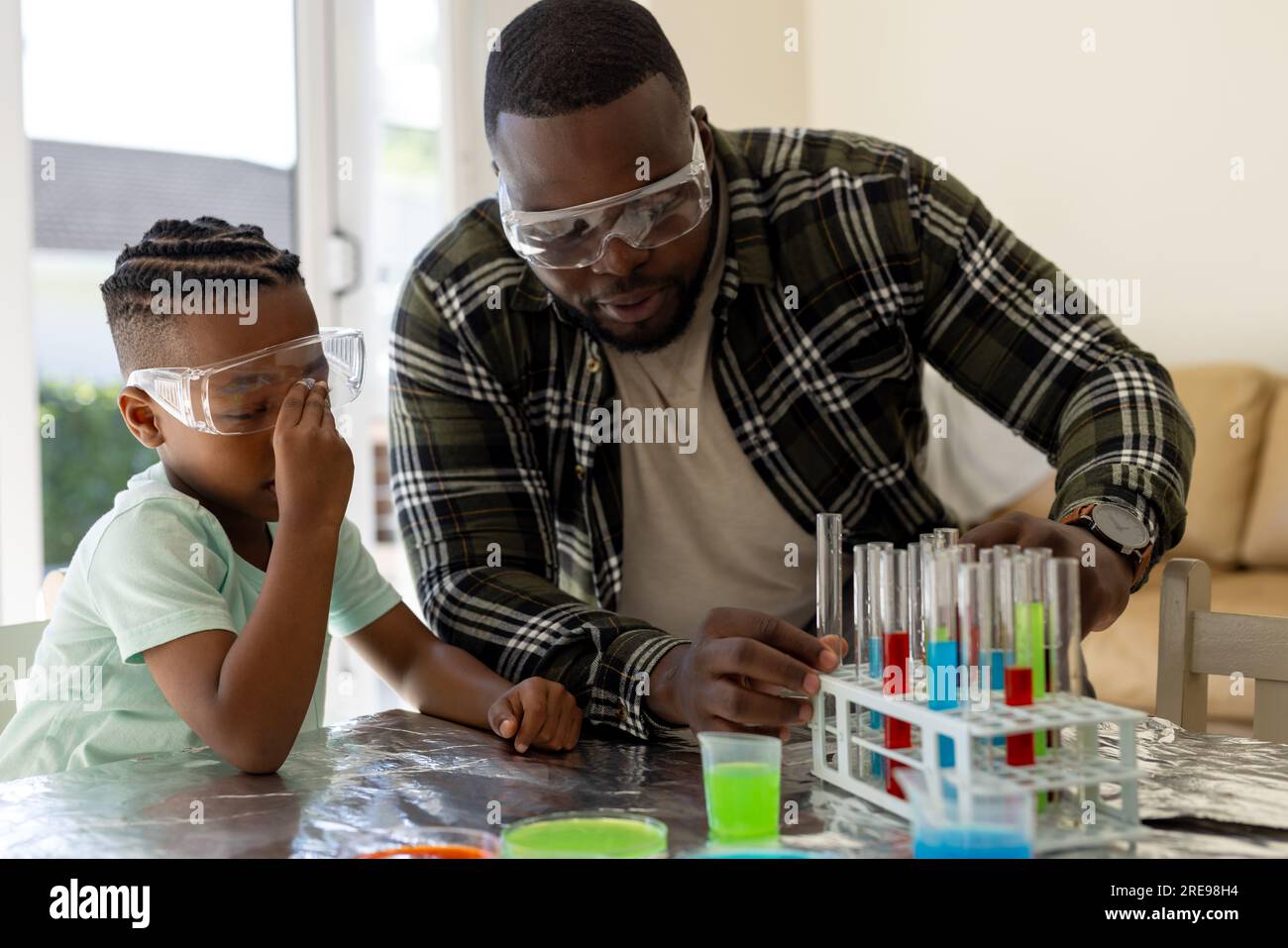 Father son experiment together in hi-res stock photography and images ...