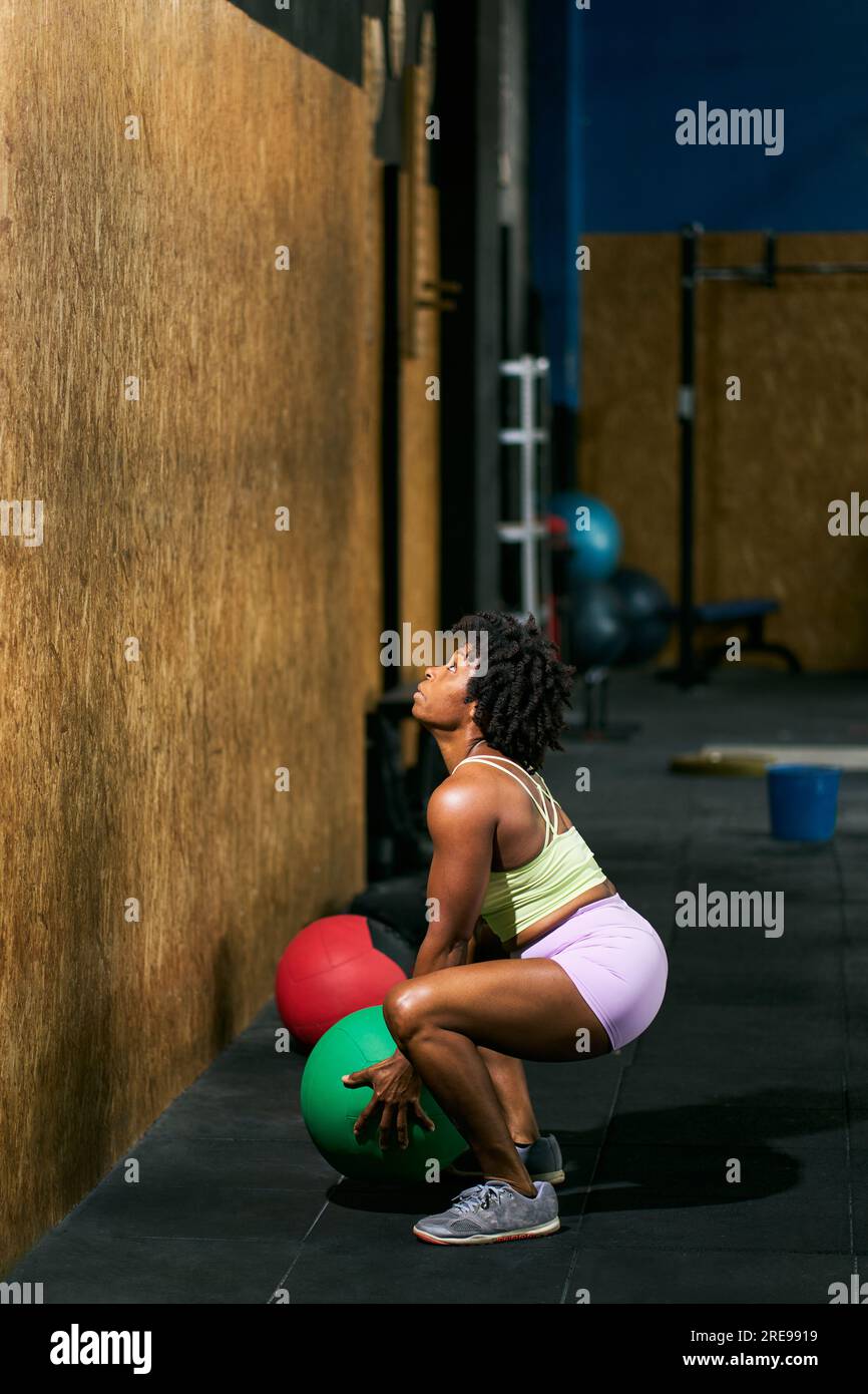 Woman fitness ball against the wall hi-res stock photography and images ...