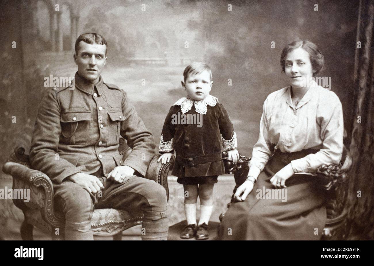 A British soldier of the Machine Gune Corps with his wife and son during the First World War ...