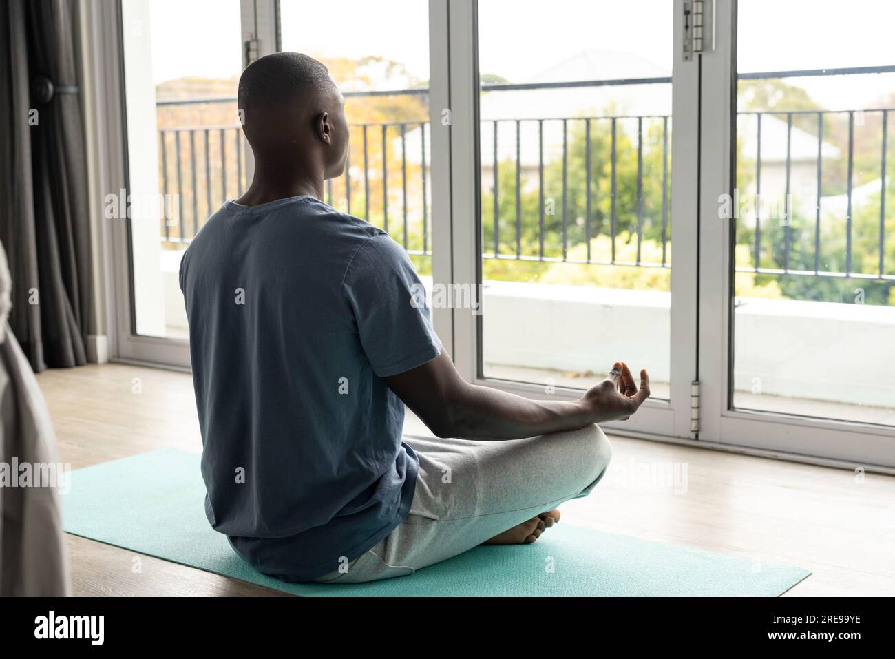 Happy african man meditating hi-res stock photography and images - Alamy