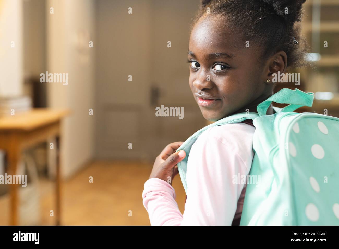 Portrait of happy african american girl wearing backpack, copy space ...