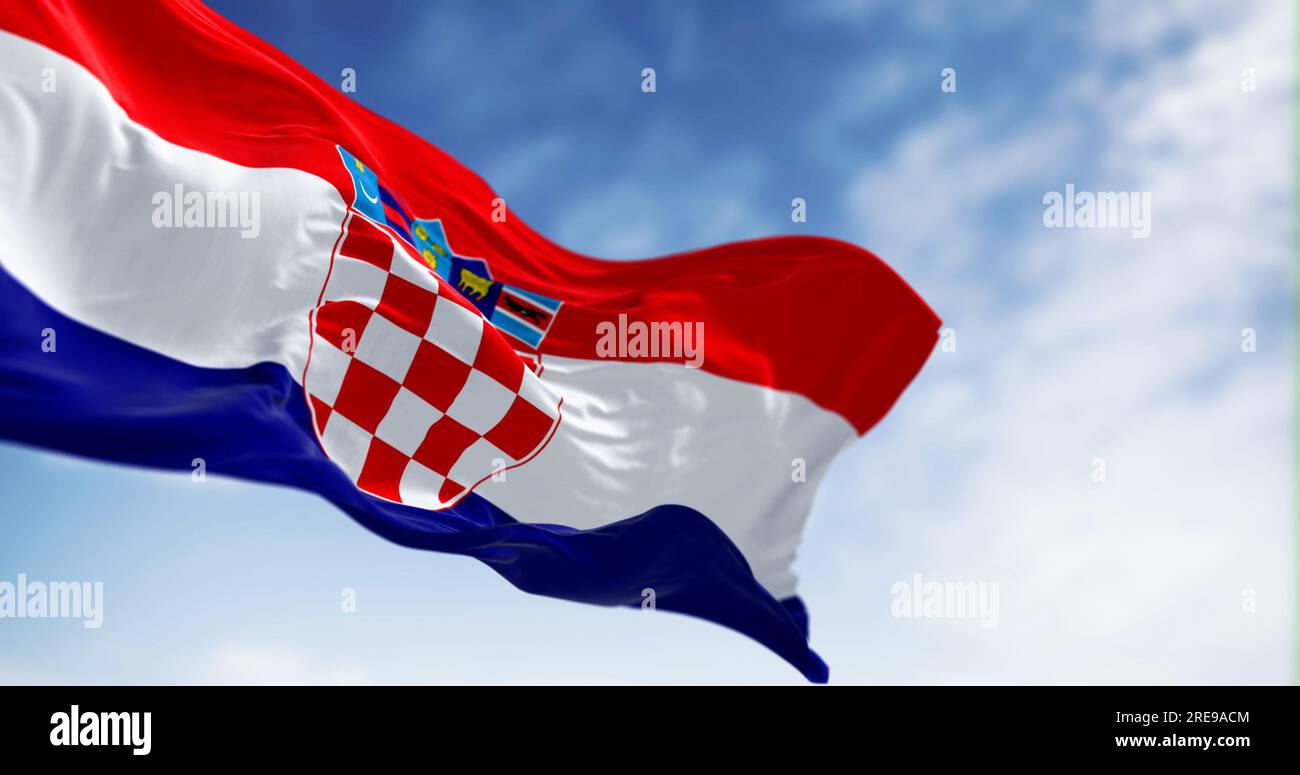 The national flag of Croatia waving in the wind on a clear day. Red ...