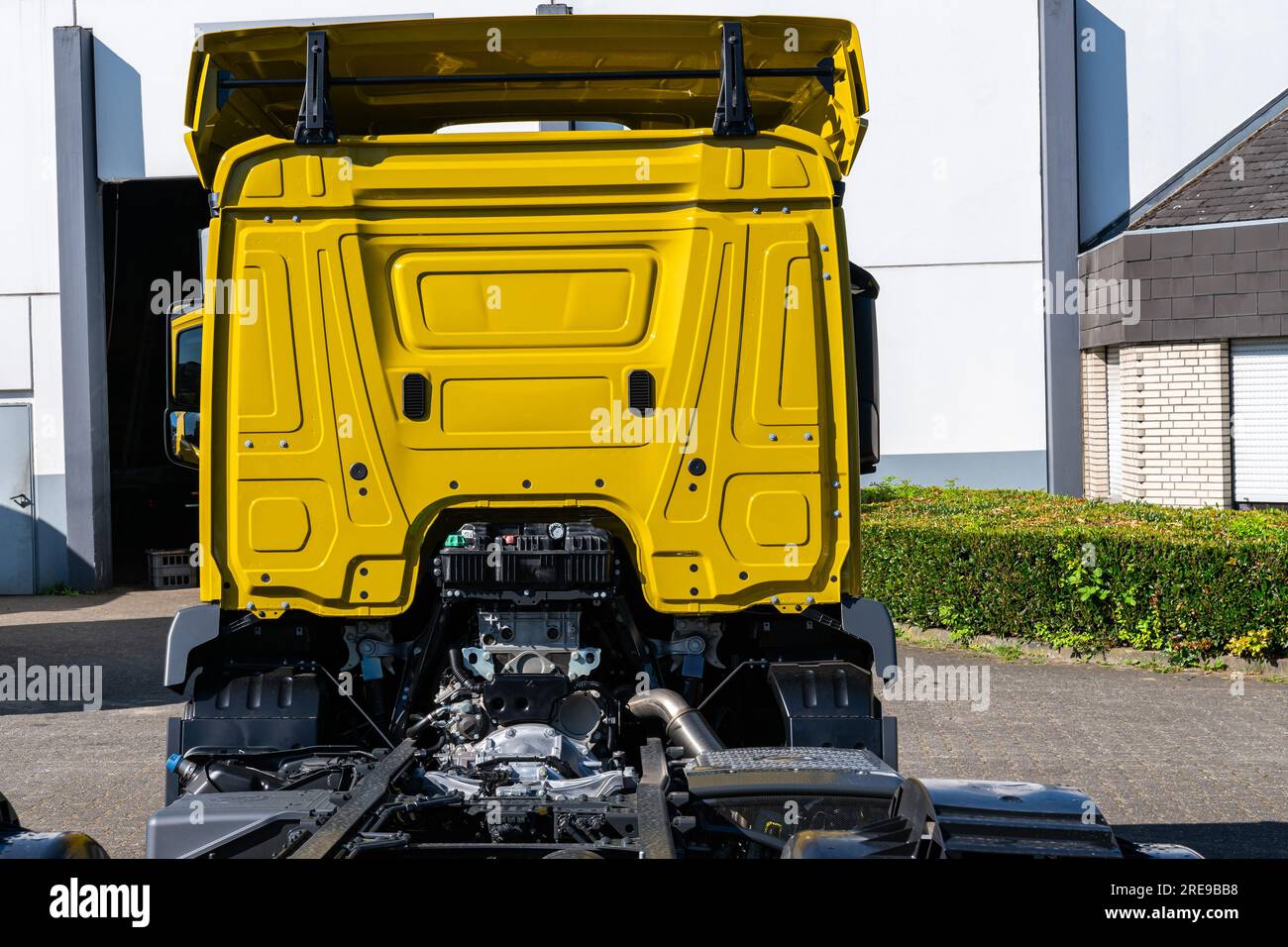 Rear view of the cab of a bright yellow cargo semi-trailer Stock Photo ...