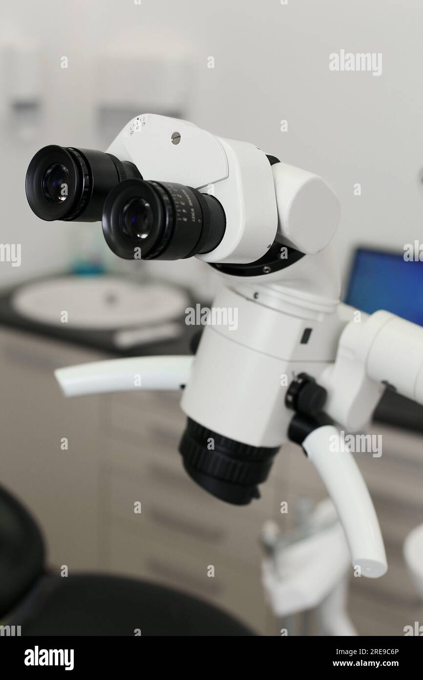 Dental Microscope in a dental office photographed on a white background ...