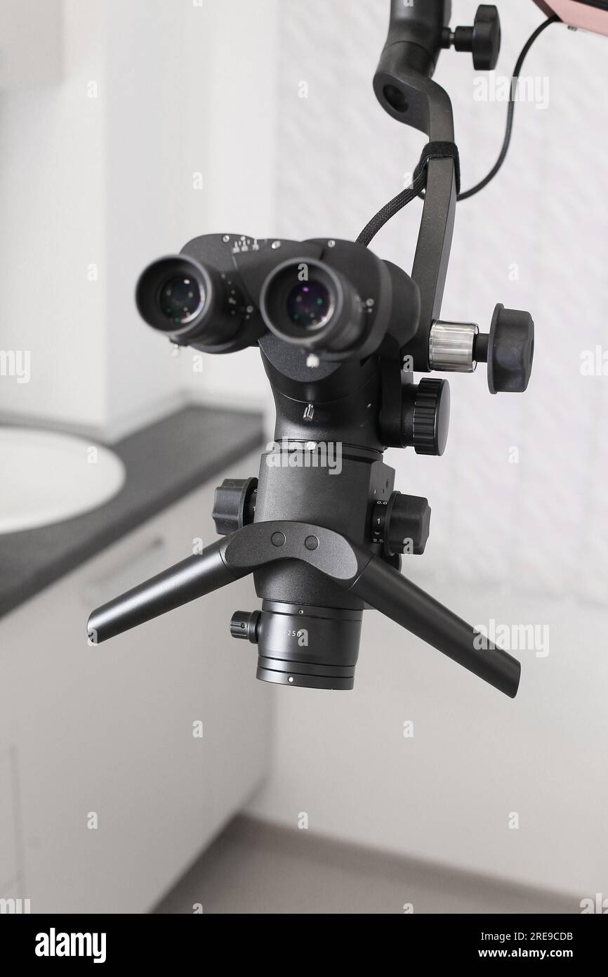 Dental Microscope in a dental office photographed on a white background ...