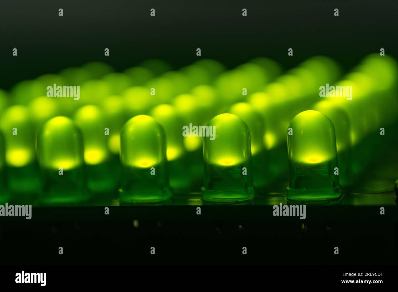 Closeup of several leds through Hole the green colour on table in dim ...