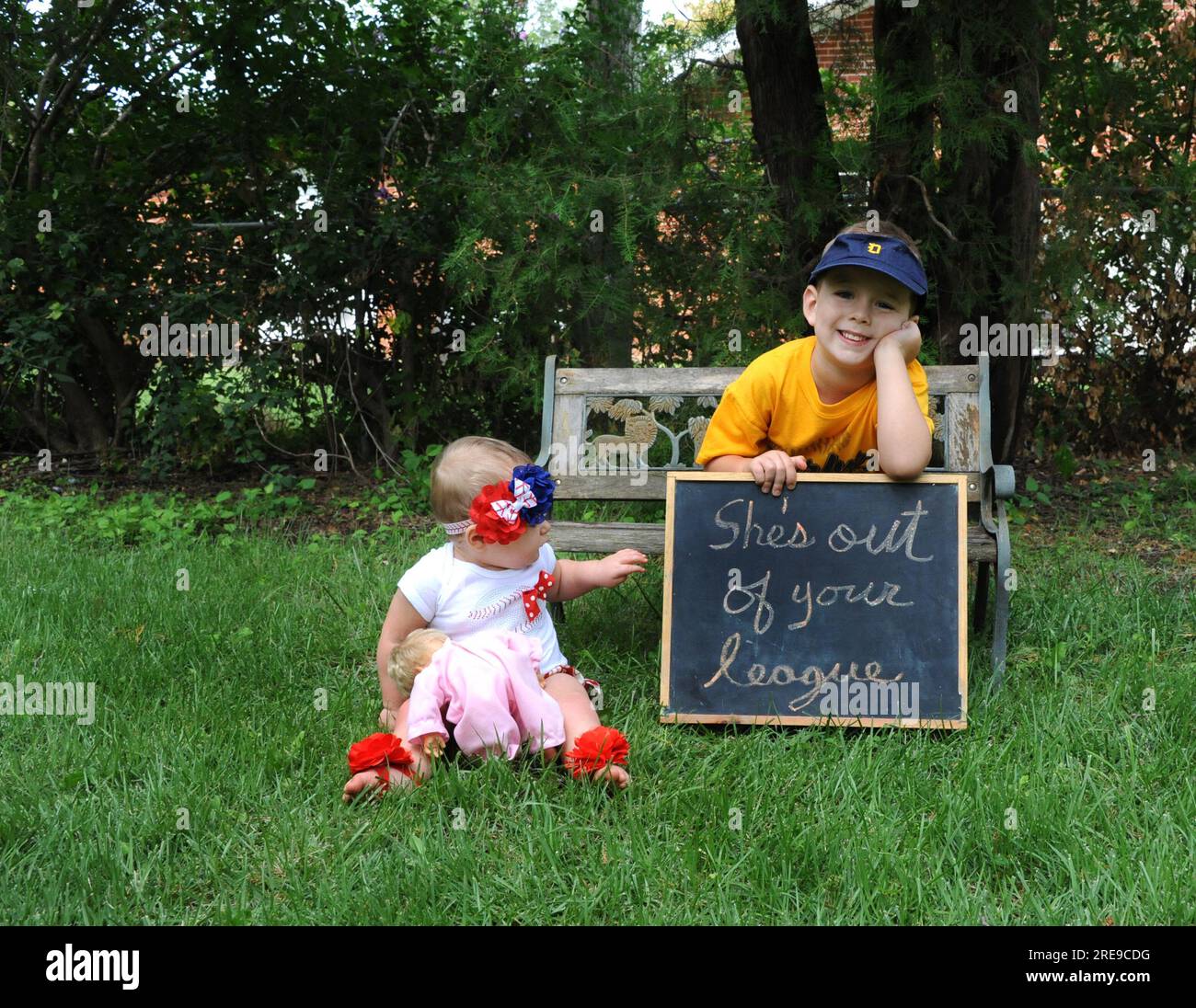 Sister seems to point at sign that warns big brother that she is "out ...