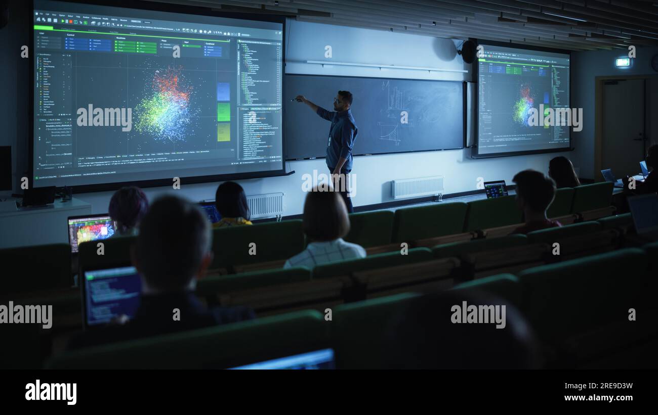 Young Male Teacher Giving a Data Science Lecture to Diverse Multiethnic ...