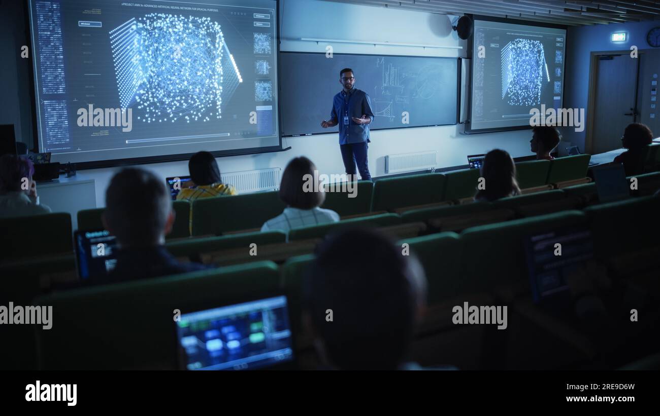 Young Male Teacher Giving a Data Science Lecture to a Diverse ...
