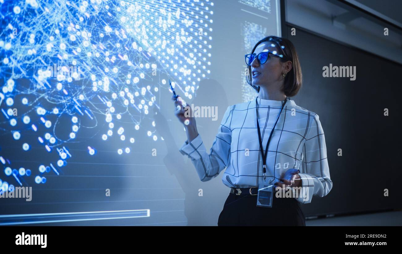 Young Female Teacher Giving a Data Science Lecture to Diverse ...