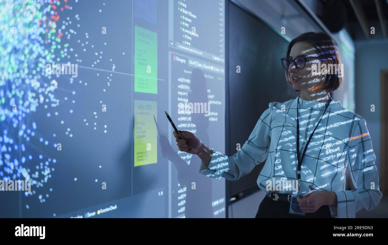 Young Female Teacher Giving a Data Science Lecture to Diverse ...