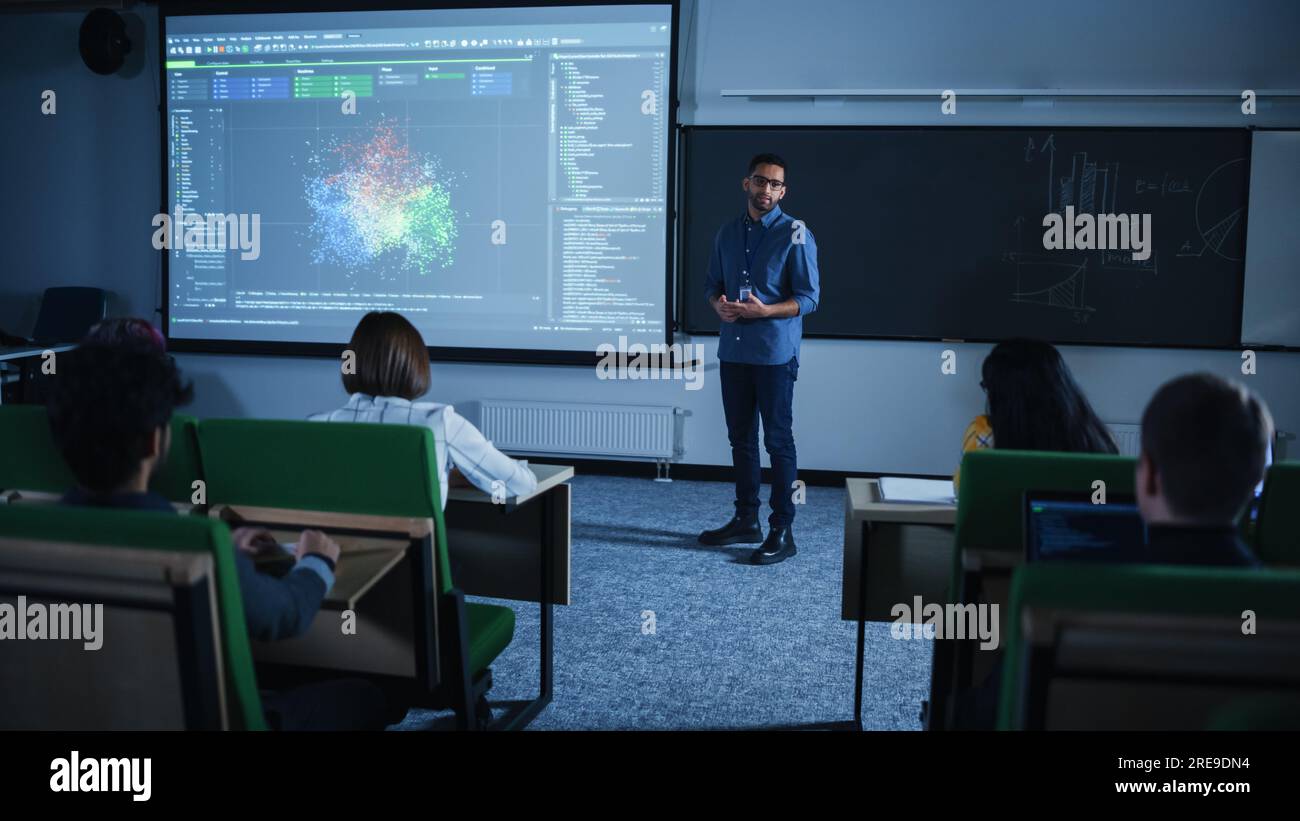 Young Male Teacher Giving a Data Science Lecture to a Diverse ...