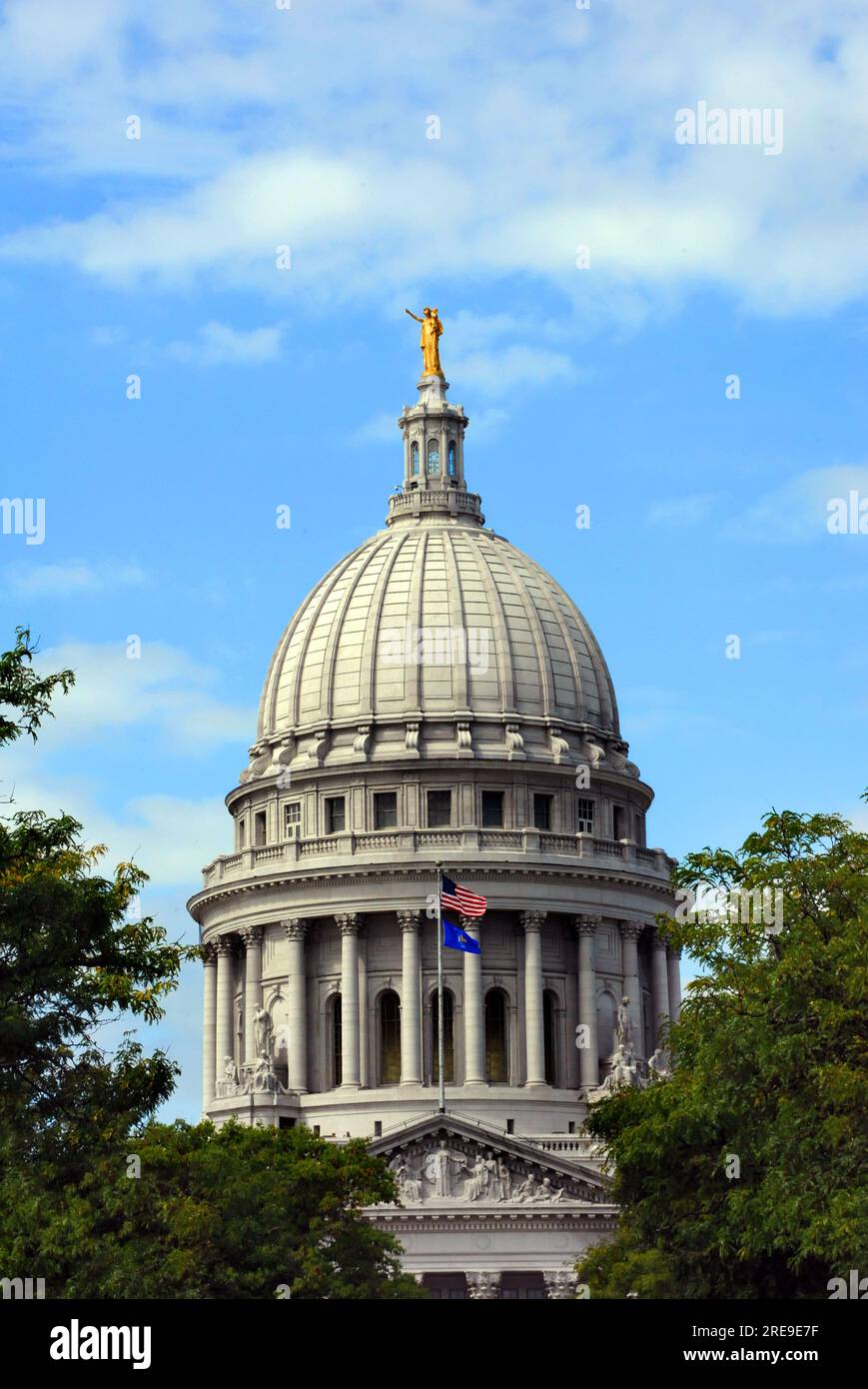Capitol building, of Wisconsin at Madison, is surrounded by blue skies ...