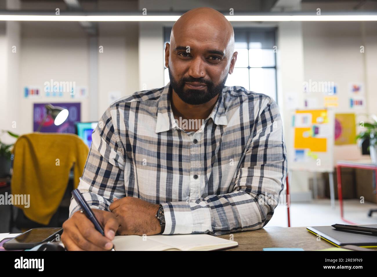 Indian man taking notes during a video call at office Stock Photo - Alamy Indian man taking notes during a video call at office Stock Photo - Alamy