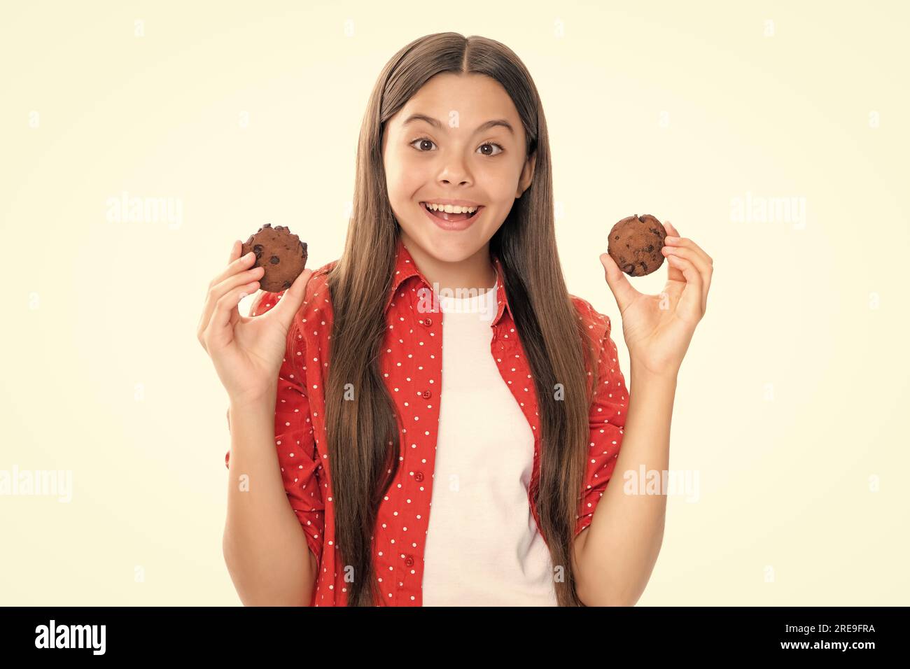 Girl and cookies. Teen girl eating cookies, snack for schoolchildren ...
