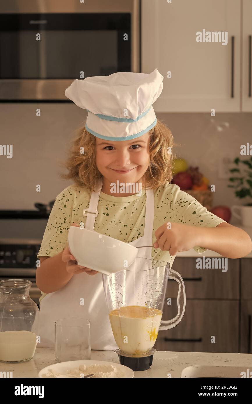 Fun kids kitchen. Funny little kid chef cook wearing uniform cook cap ...