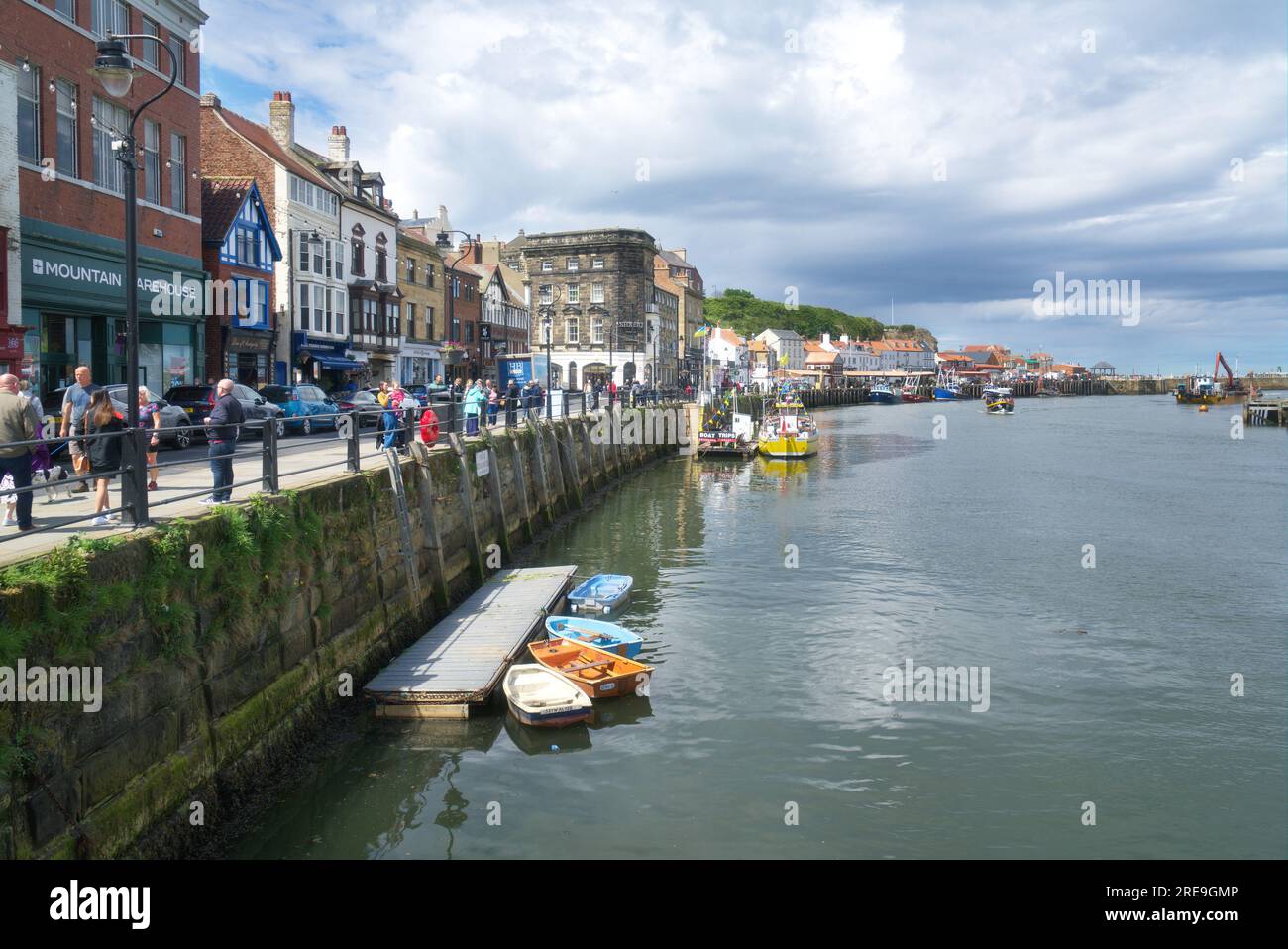 Looking east over historic Whitby keyside, wharf, beside the river Esk ...