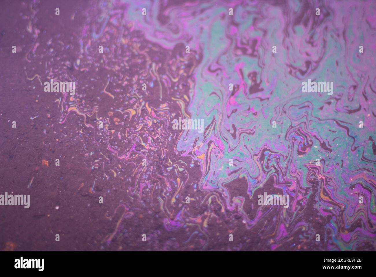 Petrol stain. Oil footprint. Bright colors. Poisoned water. Acidic ...