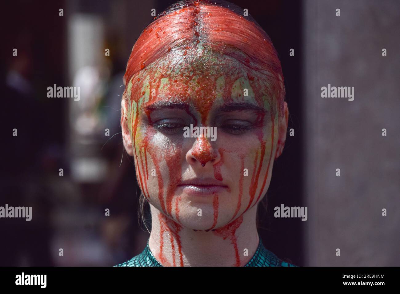 London, UK. 26th July, 2023. Vegan activist Tash Peterson seen covered ...