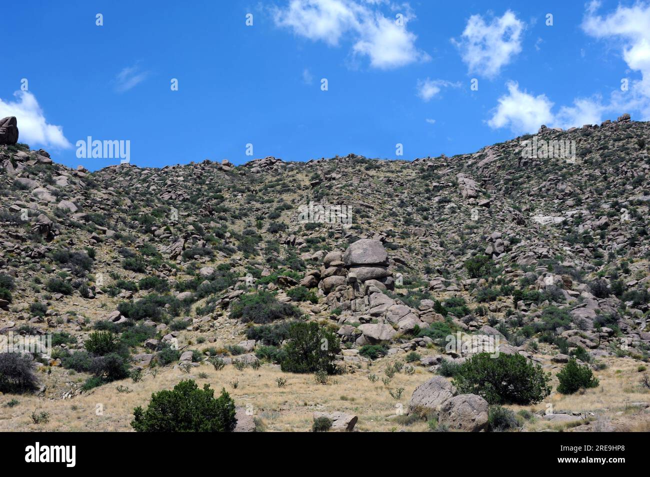 The Sandia Mountains are rugged and rocky. Large boulder formation sits ...
