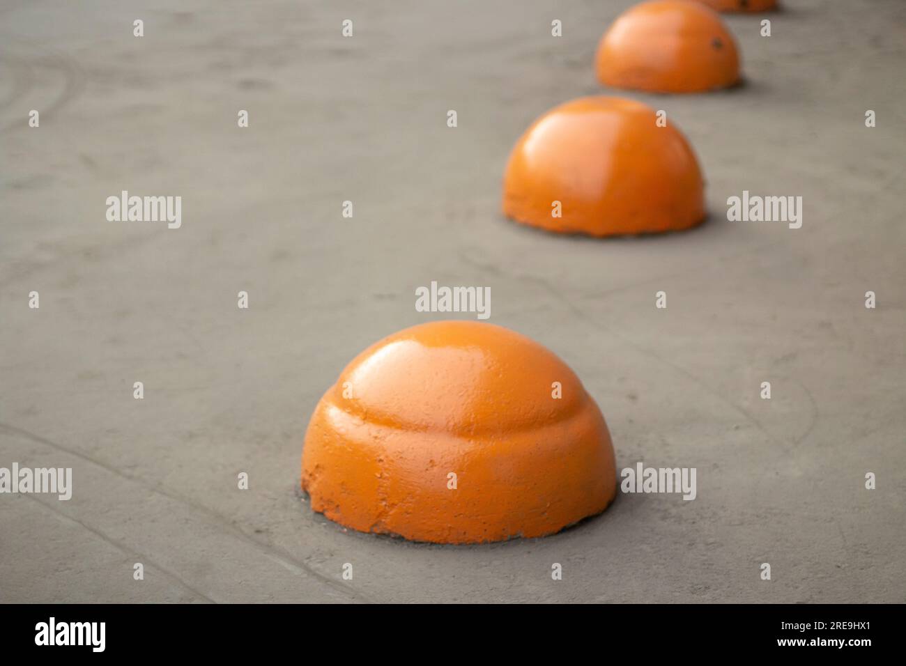 Parking areas. Orange spheres on road. Parking space closed. Motion ...