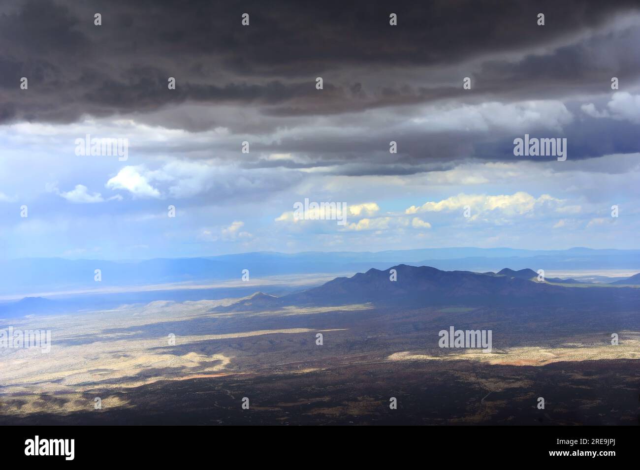 Dark thunder storm clouds approach Crest of the Sandia Mountains from ...