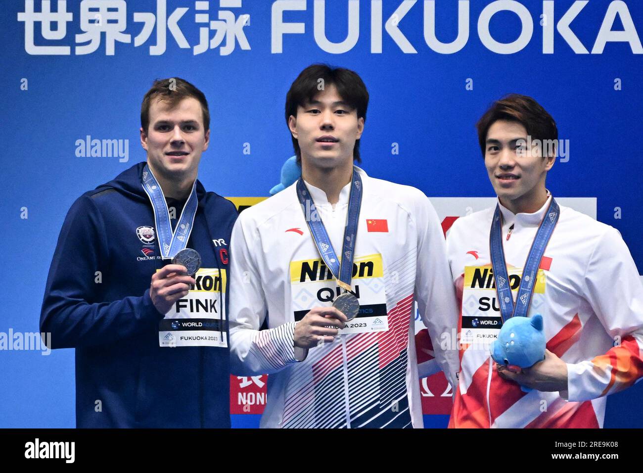 Fukuoka, Japan. 26th July, 2023. Gold medalist Qin Haiyang (C) of China, silver medalist Nic ...
