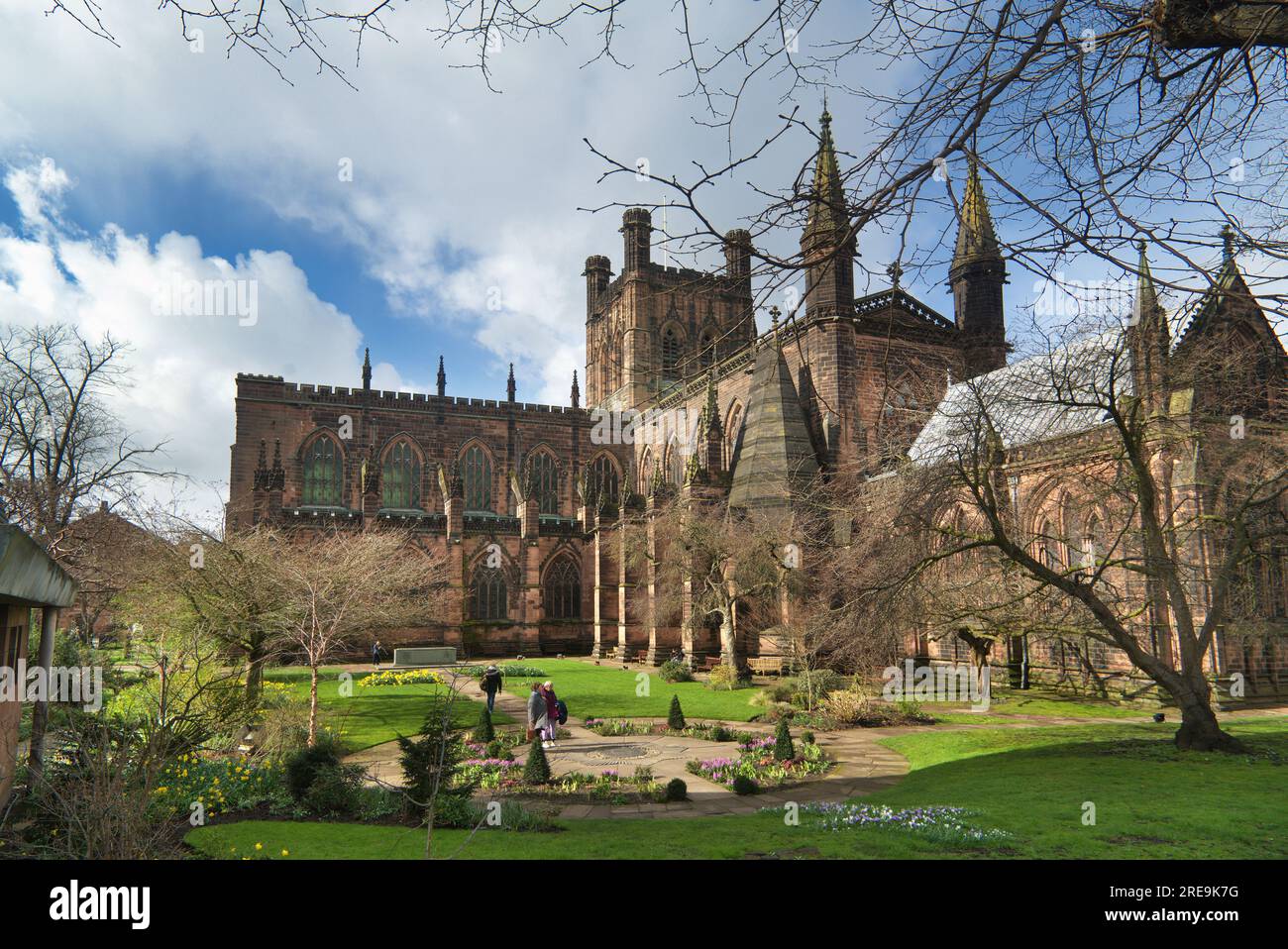 Chester cathedral in spring with daffodils in gardens, City centre ...