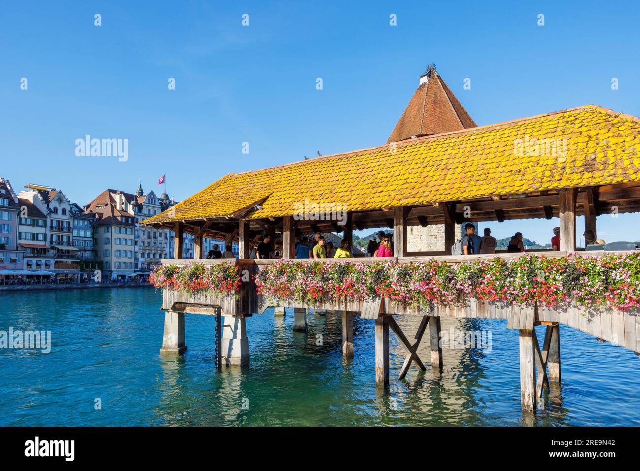 The historic wooden Chapel Bridge (Kapellbrucke) spanning the River ...