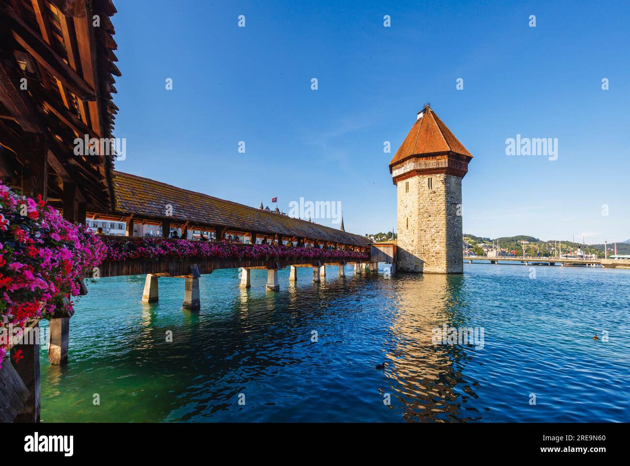 The historic wooden Chapel Bridge (Kapellbrucke) spanning the River ...