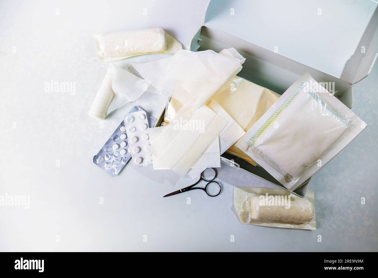 Open first aid kit for travel and as home medicine chest with bandages ...