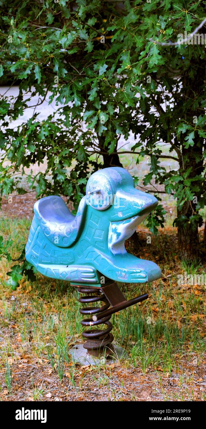 Vintage frog, park, riding toy is spring supported to rock back and ...