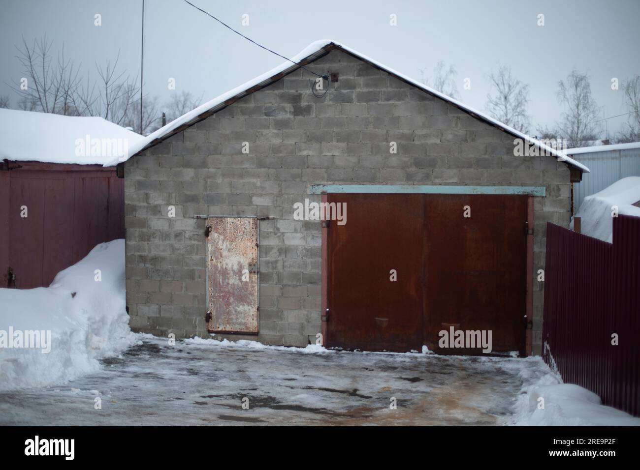 Garage for transport. Concrete house. Rusty gates. Garage block. Ridge ...
