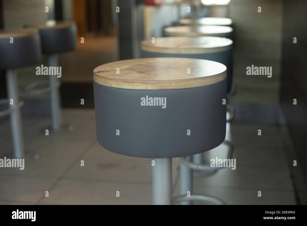 Round seat. Seating for visitors. Empty space. Bar Stock Photo - Alamy