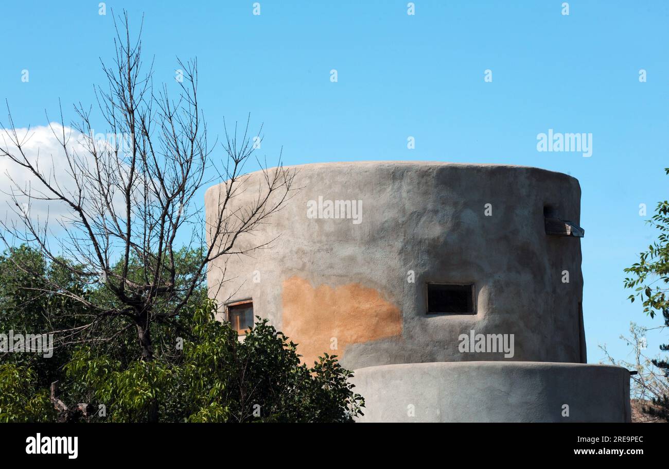 Round, roof tops a cement home in Central New Mexico. It also has small ...