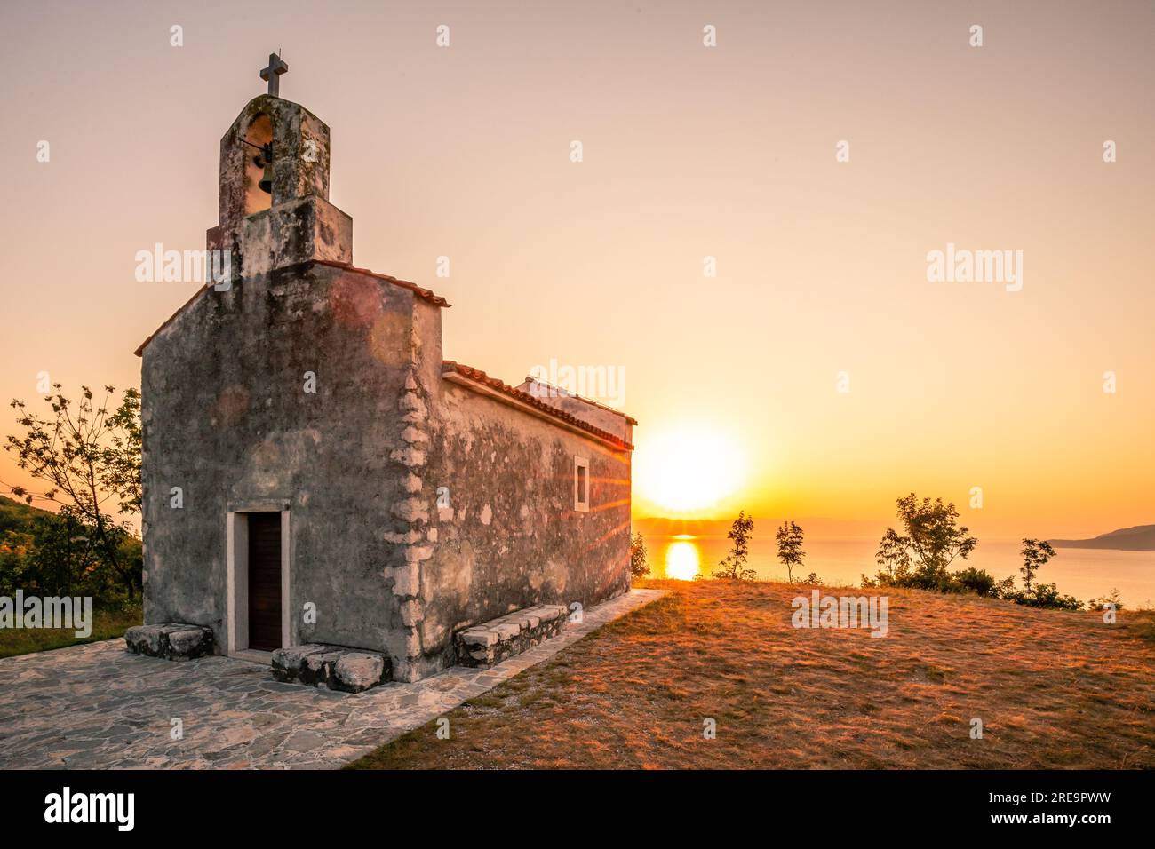 Beautiful little church by the sea in sunrise or sunset. Landscape shot ...