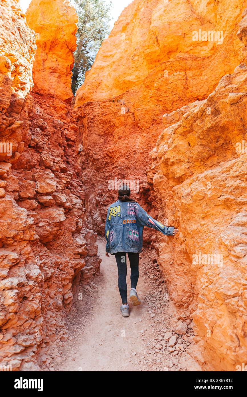 Hiker Girl In Bryce Canyon Hiking Relaxing Looking At Amazing View During Hike On Summer Travel