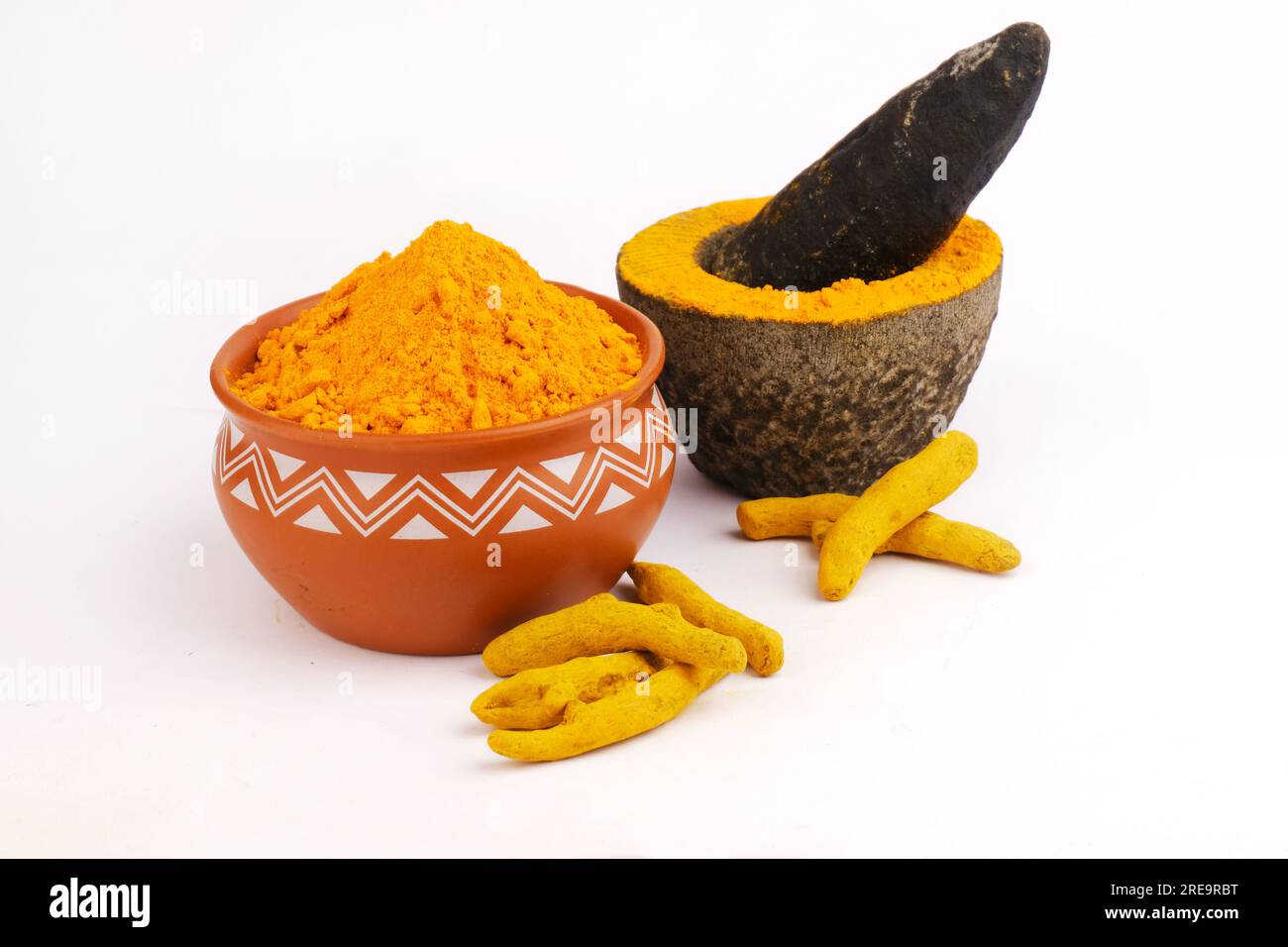 Dry turmeric powder (curcuma longa linn) stone mortar, traditional ...