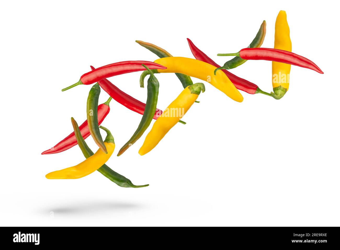 Pods of different colors hot peppers of various sizes and shapes fall ...